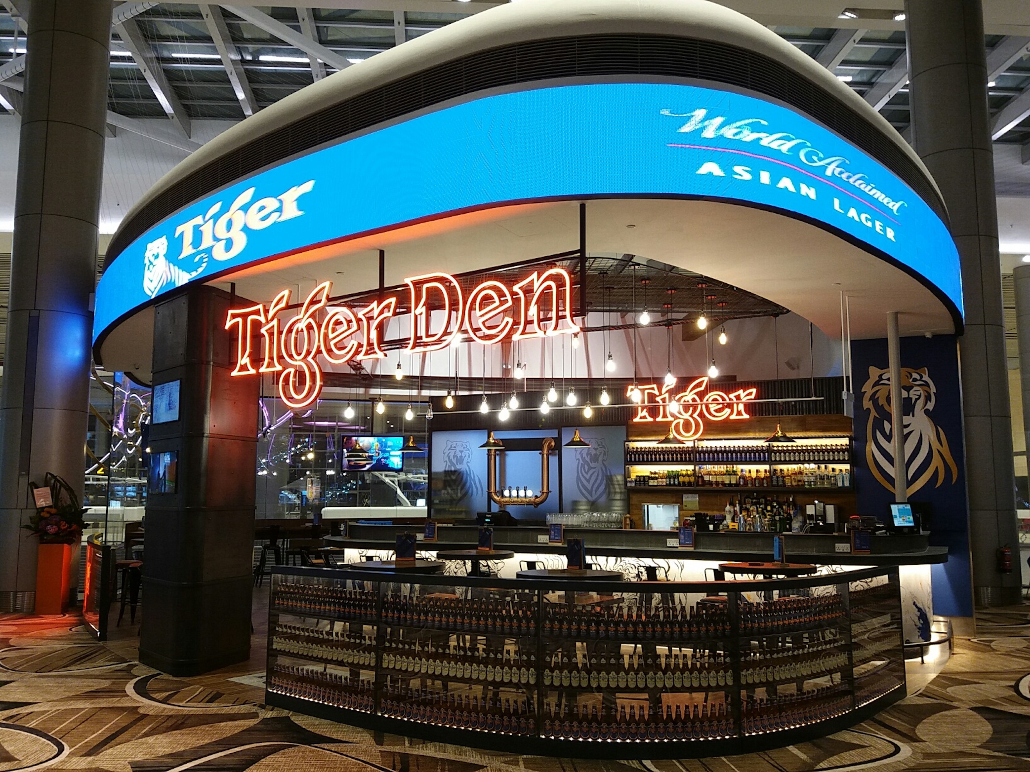 Beer with a bite: Emirates Leisure Retail opens Tiger Den bar at Changi ...